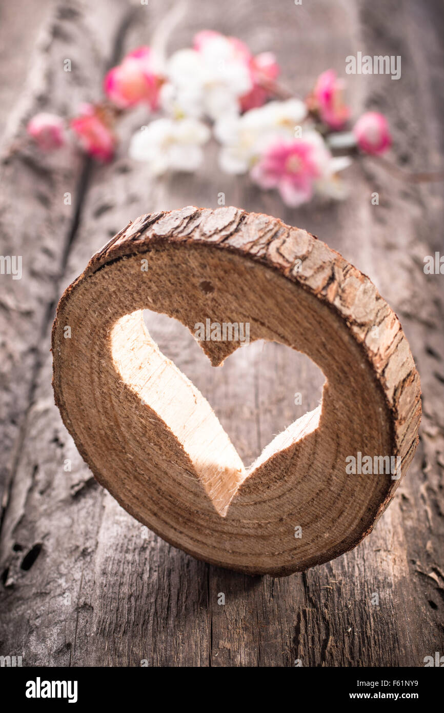 Light heart on rustic wooden background Stock Photo - Alamy