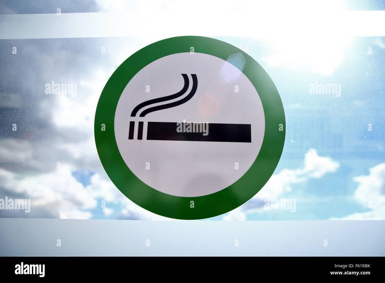 Picture of a sign marking the designated smoking area on a window Stock ...