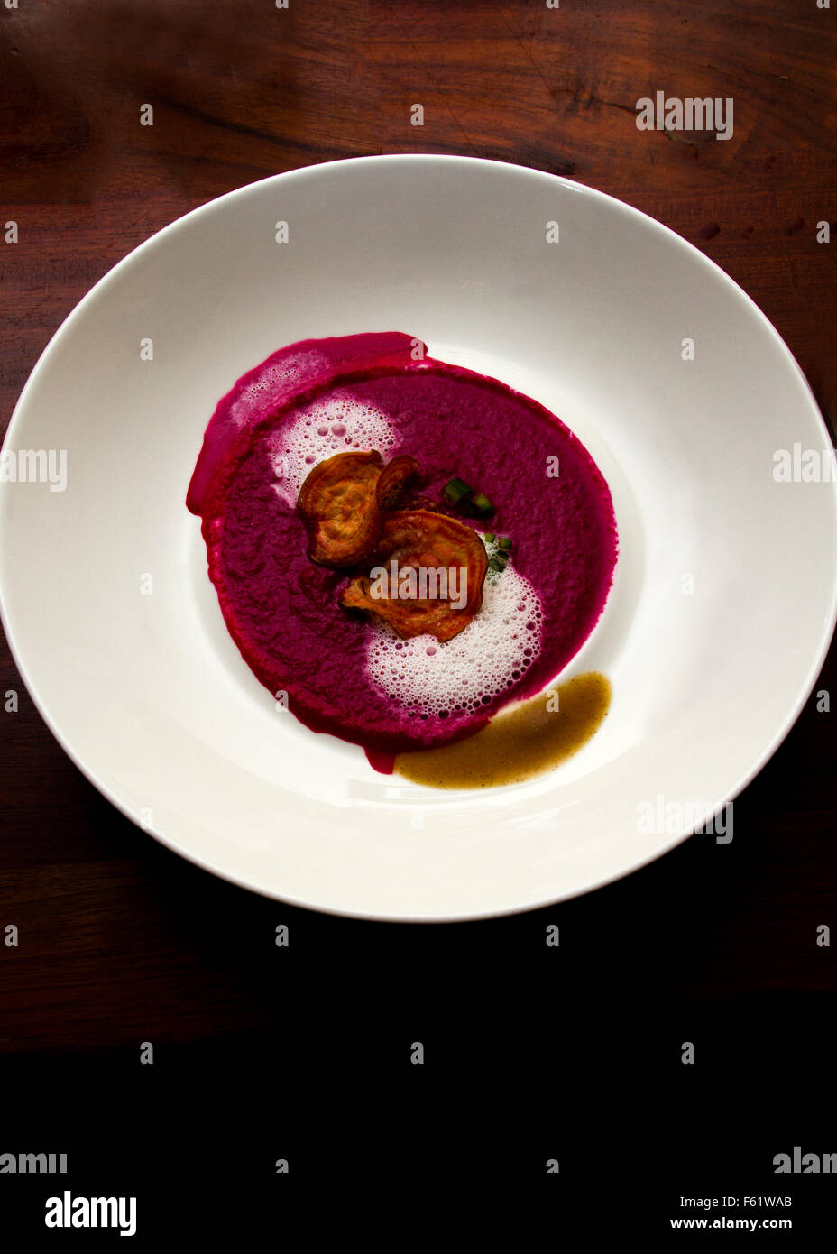 Pureed beet soup with roasted beet chips Stock Photo - Alamy