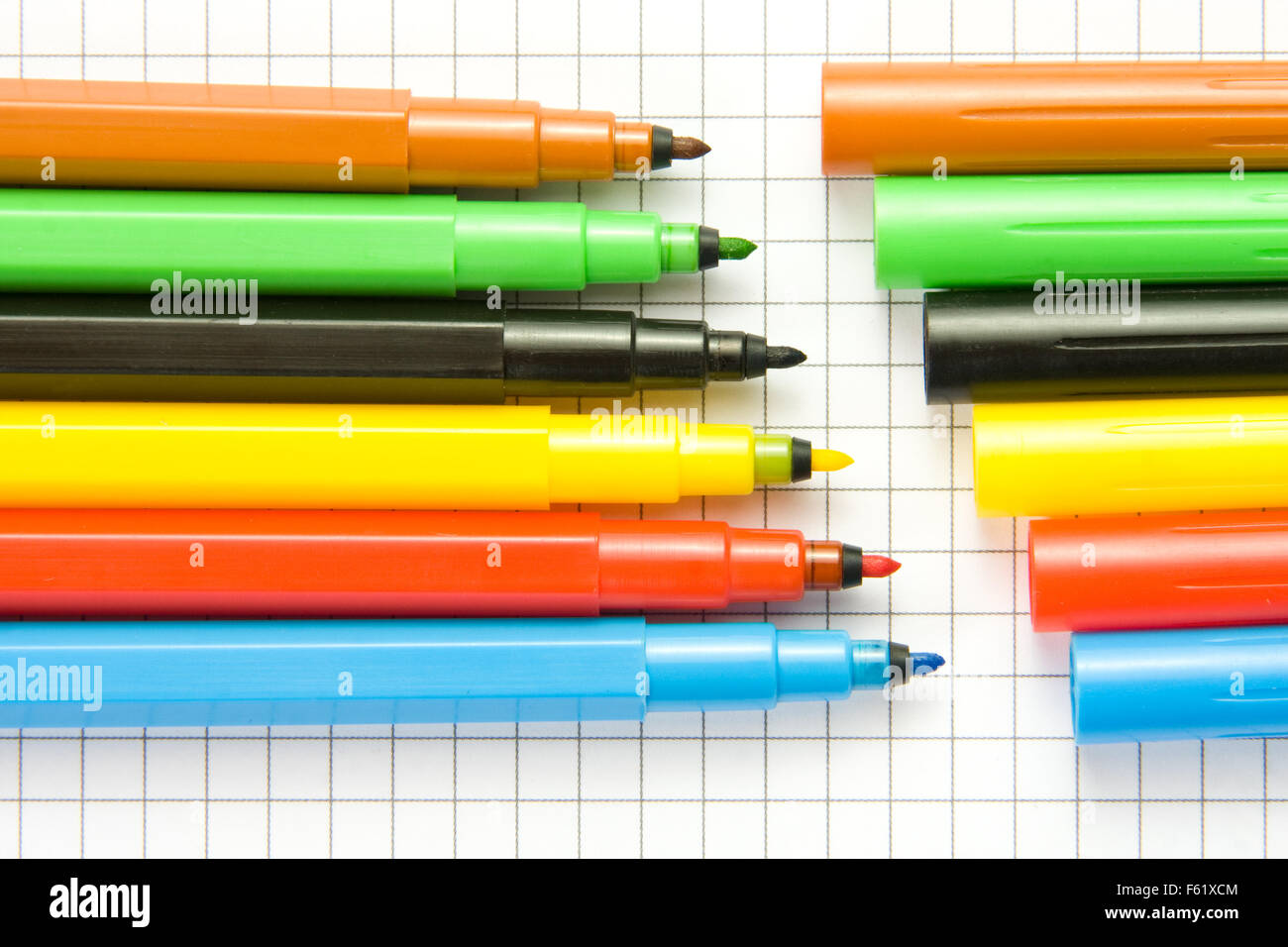 Open color markers on notepad Stock Photo - Alamy