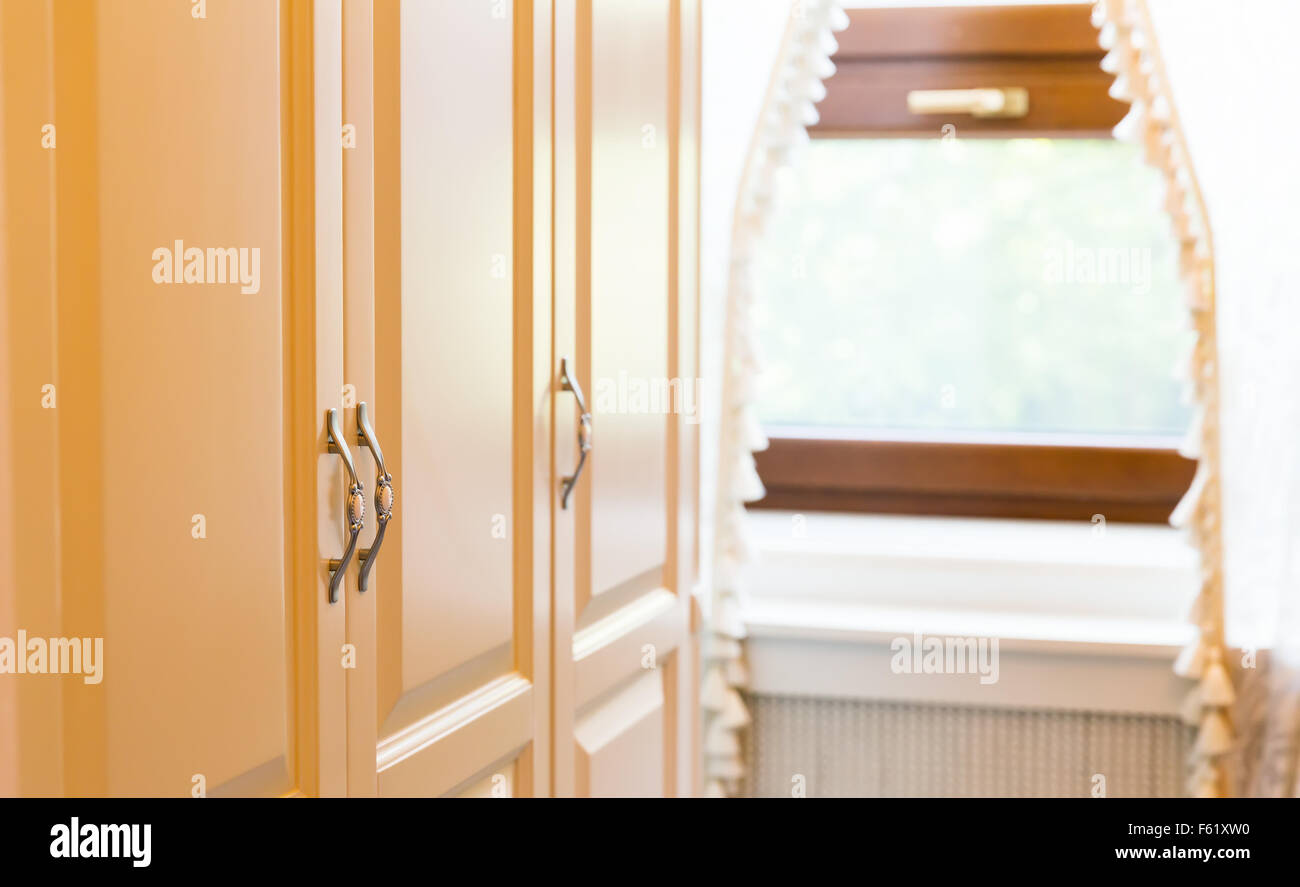Modern wooden cupboard with handle close up Stock Photo - Alamy