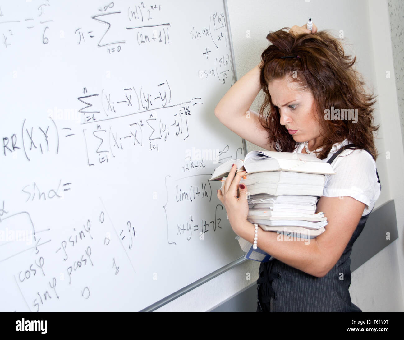 Thinking student at blackboard. Crazy mathematics Stock Photo - Alamy