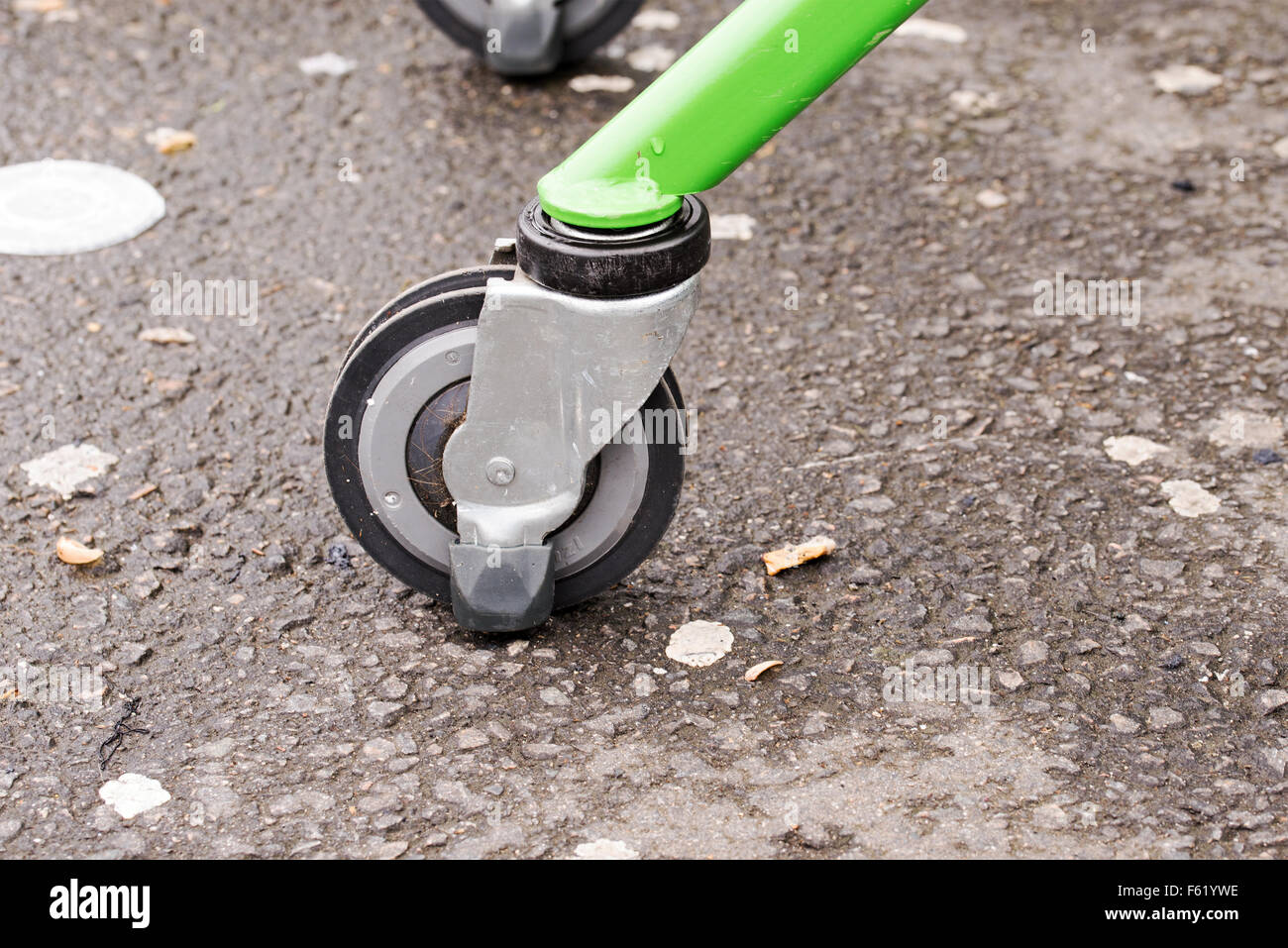 Wheel of shopping cart Stock Photo - Alamy