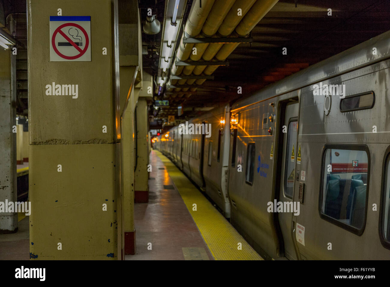 A train and "No Smoking" sign on a platform at Pennsylvania (Penn ...