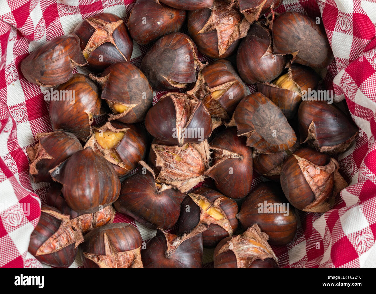 cooked chestnuts in a red cloth Stock Photo - Alamy