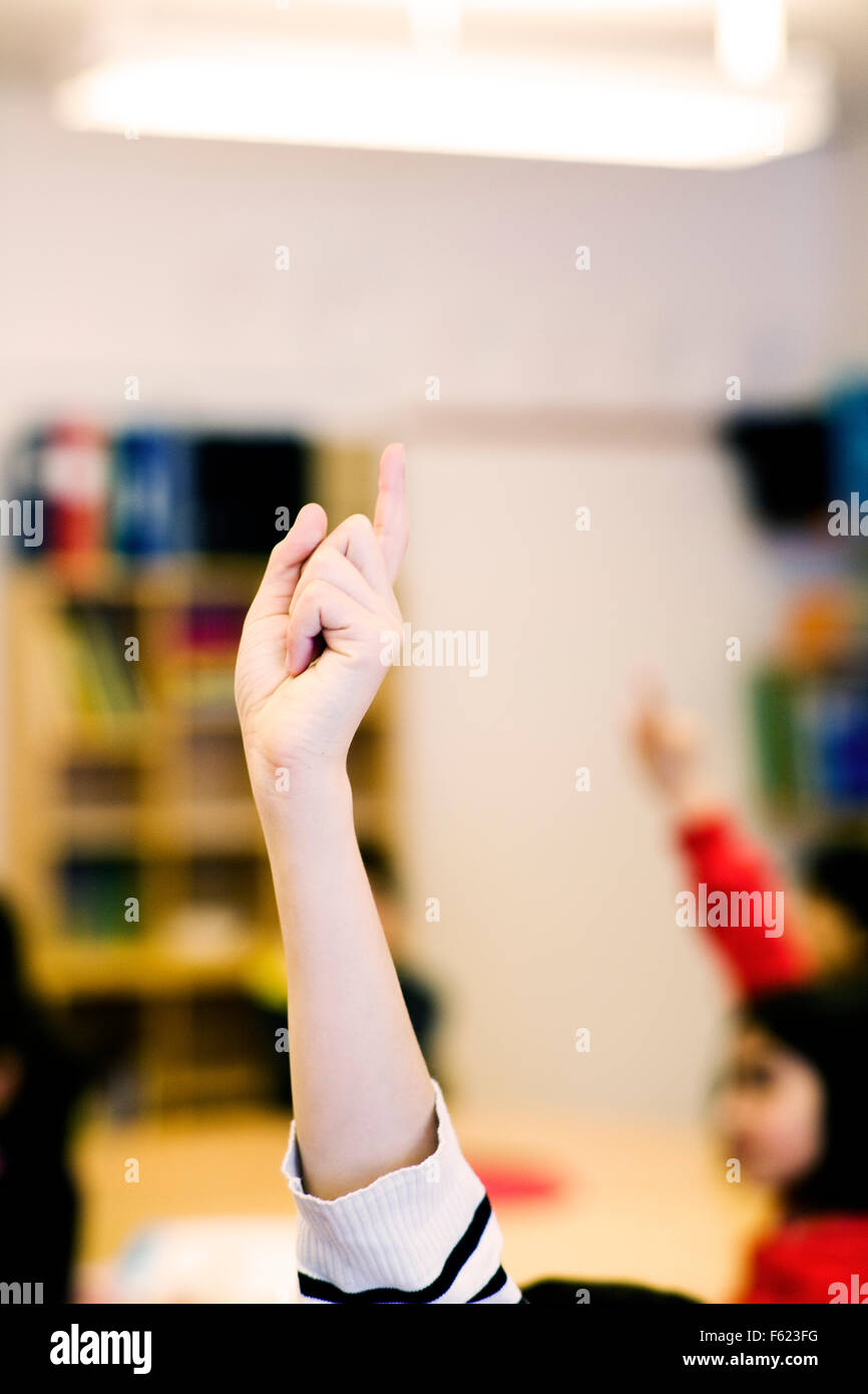 Classroom raising hands hi-res stock photography and images - Alamy