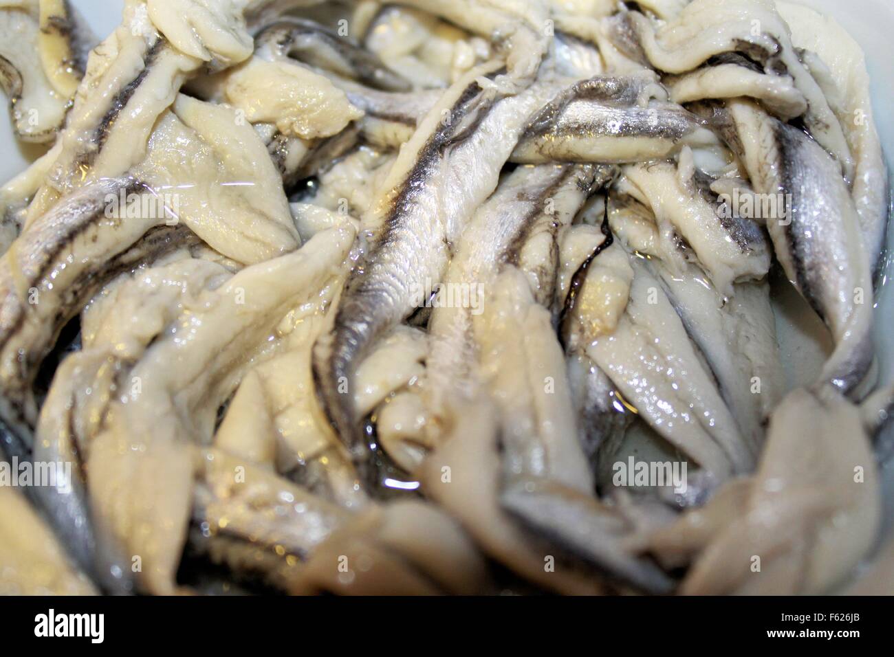 anchovy fillets marinated in small bowl Stock Photo - Alamy