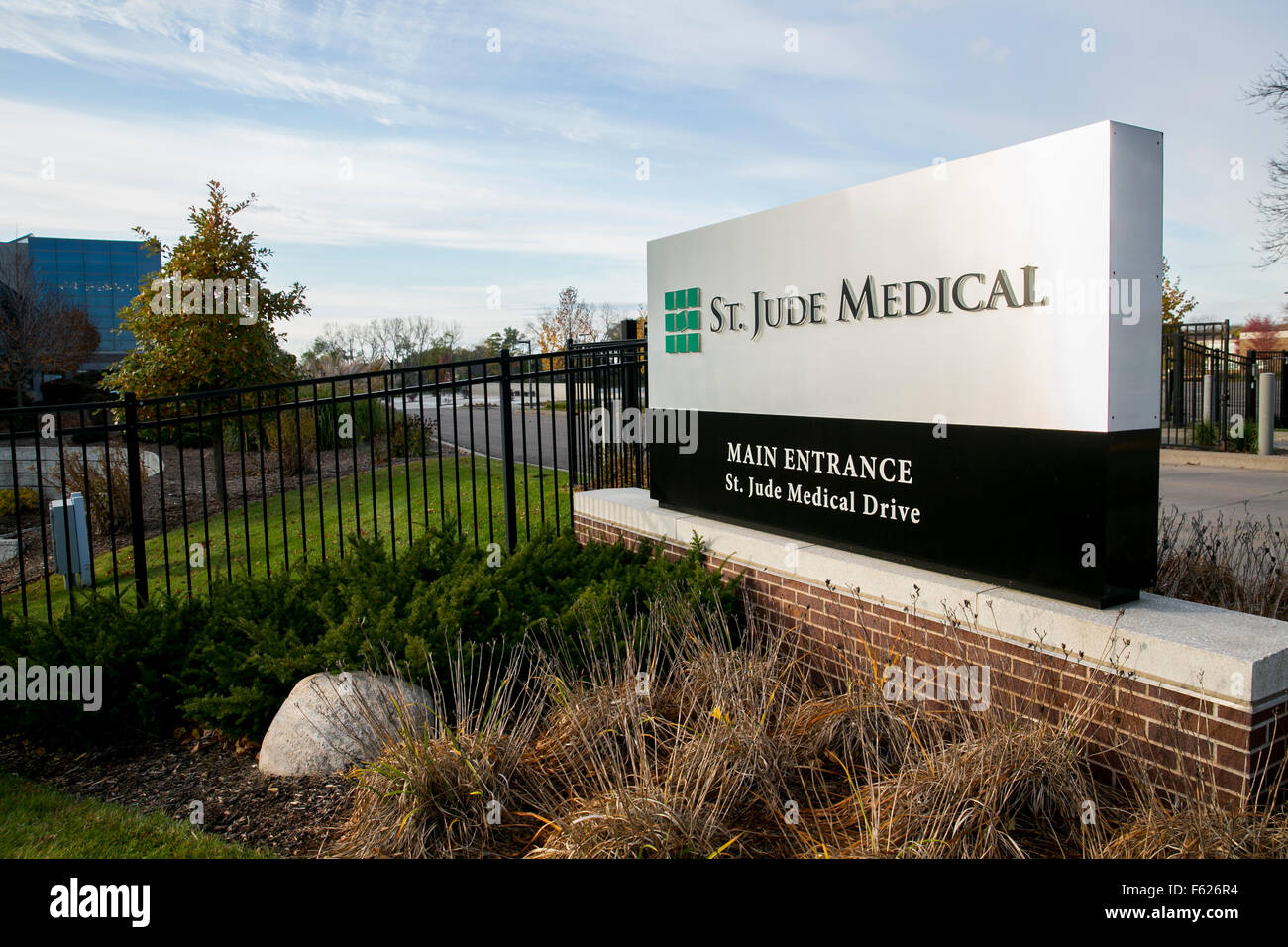 A logo sign outside of the headquarters of St. Jude Medical, Inc., in ...