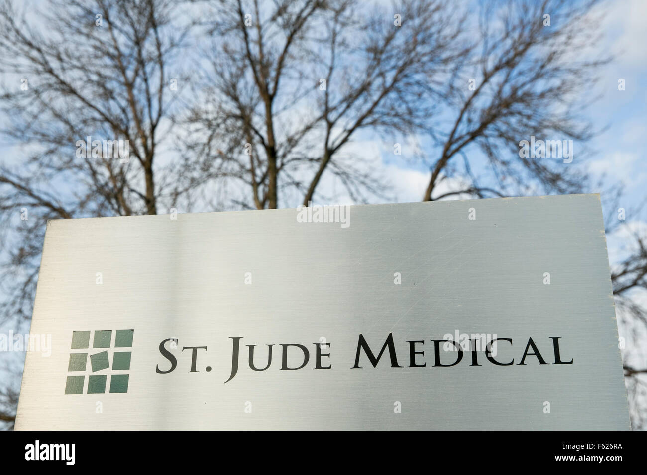 A logo sign outside of the headquarters of St. Jude Medical, Inc., in ...