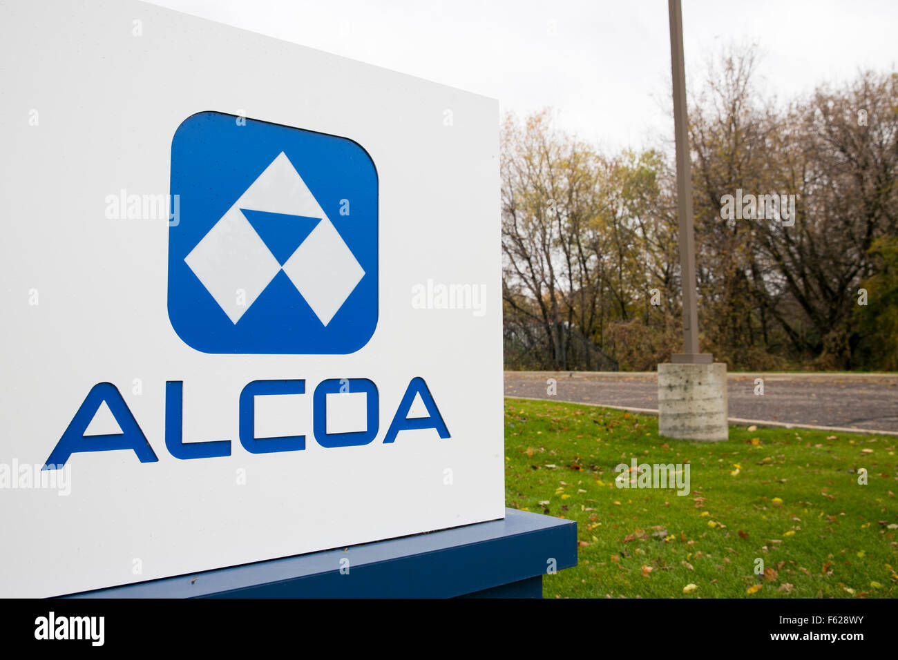 A logo sign outside of a facility occupied by Alcoa Titanium ...