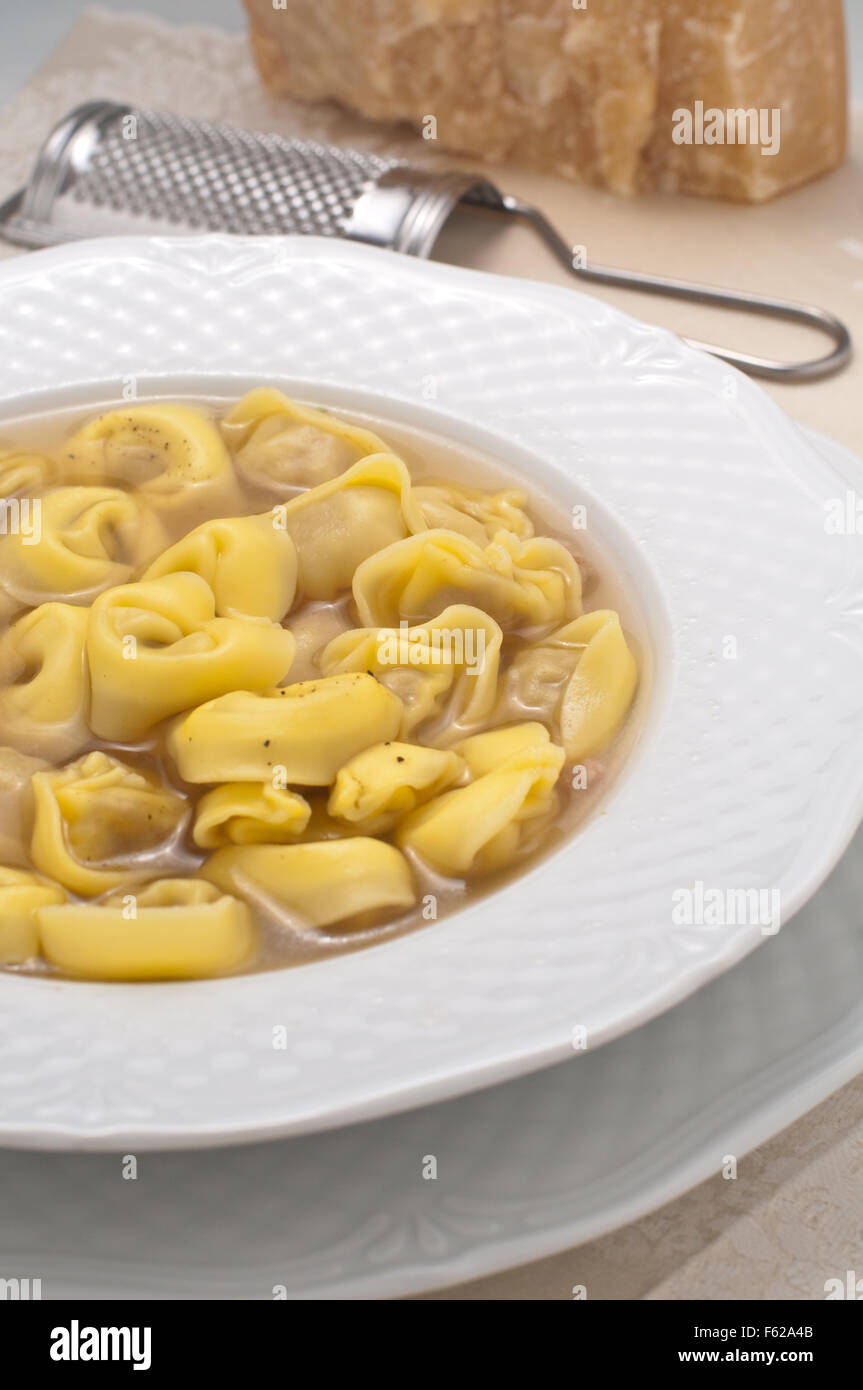 Italian ravioli stuffed with meat cooked in broth with cheese Stock ...