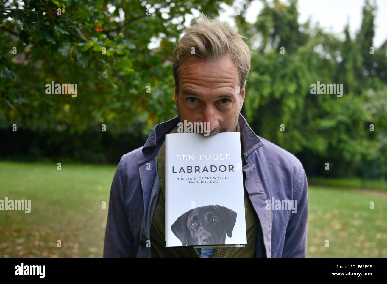 TV presenter Ben Fogle, joined by Labradors Maggie and Storm, holds a ...