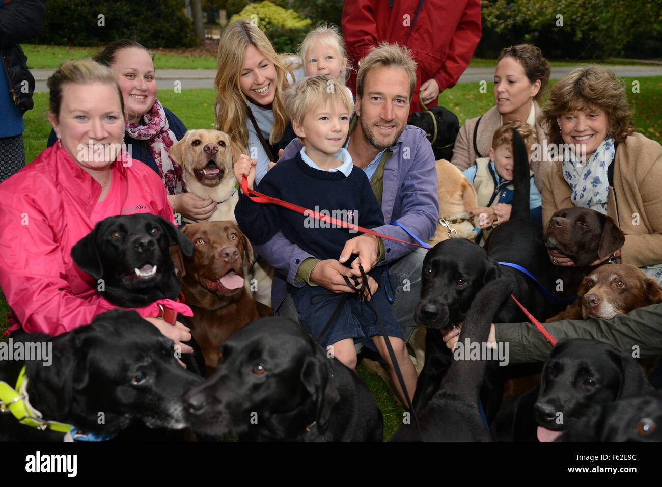TV presenter Ben Fogle, joined by Labradors Maggie and Storm, holds a ...