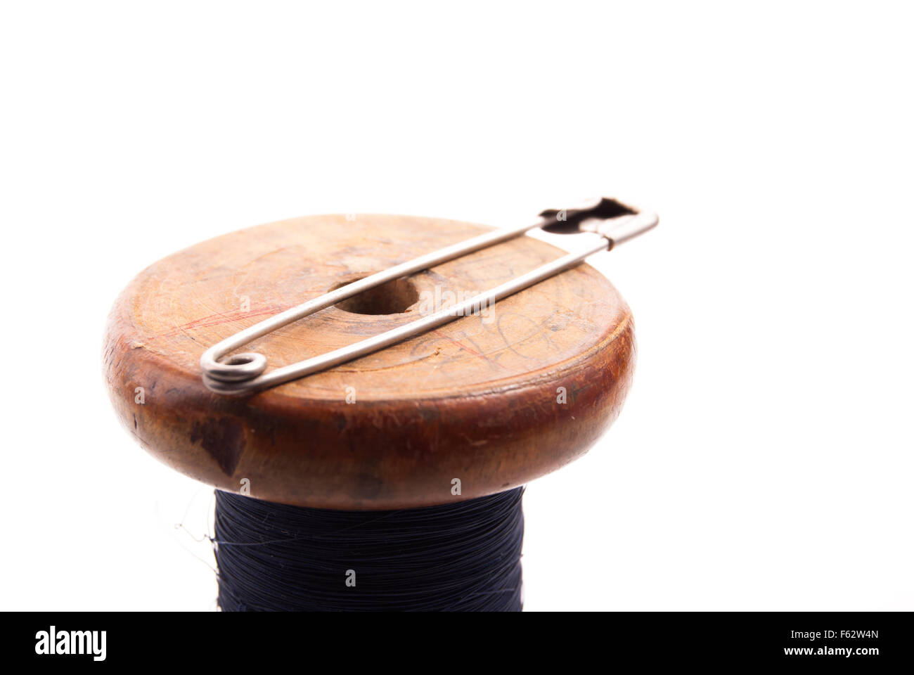 spool of thread with needle Stock Photo - Alamy