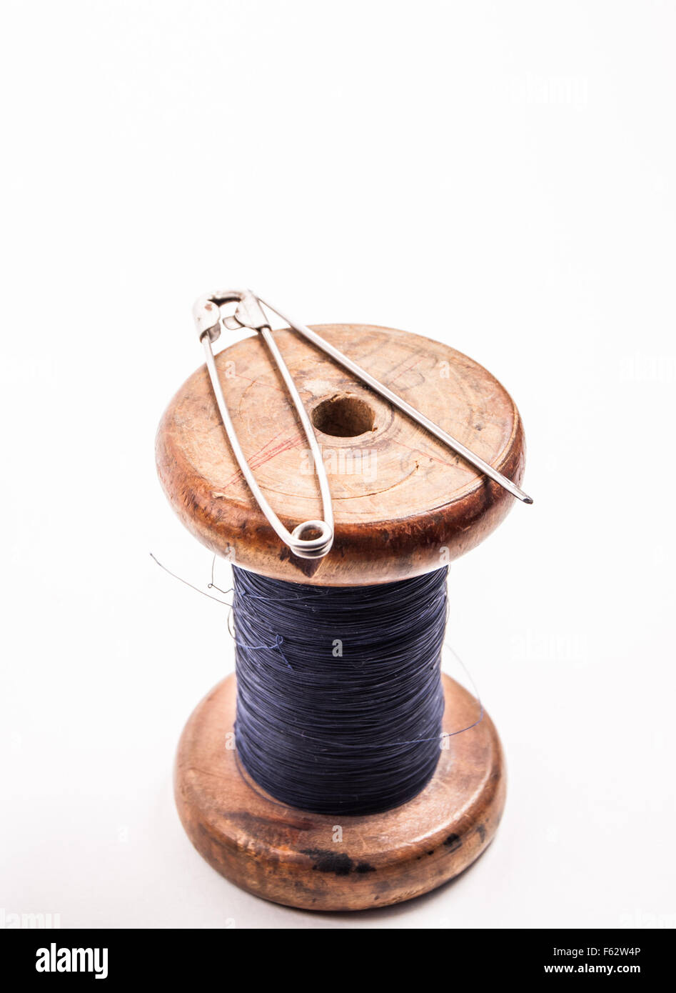 spool of thread with needle Stock Photo - Alamy