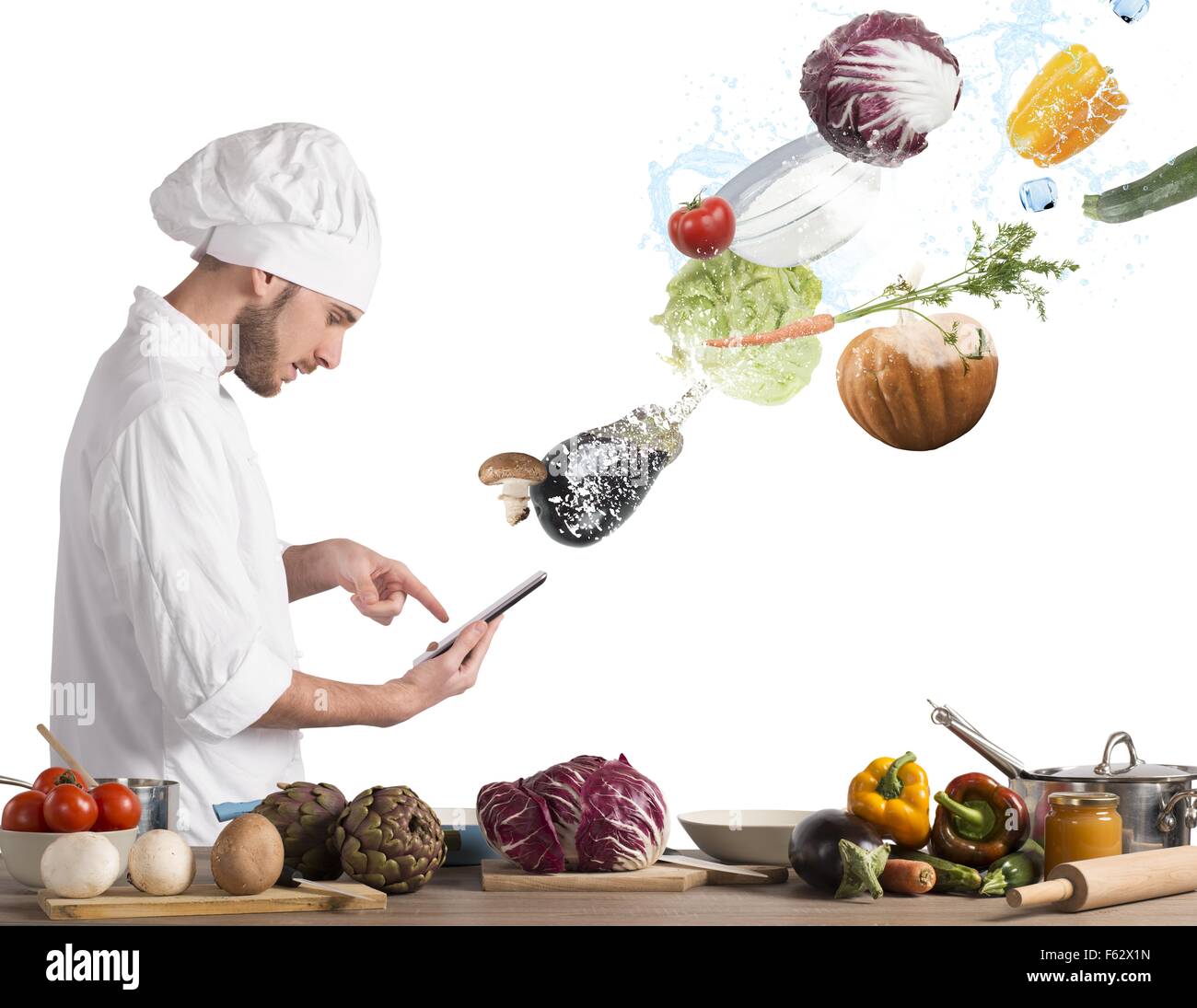 Cooking recipe from tablet Stock Photo - Alamy