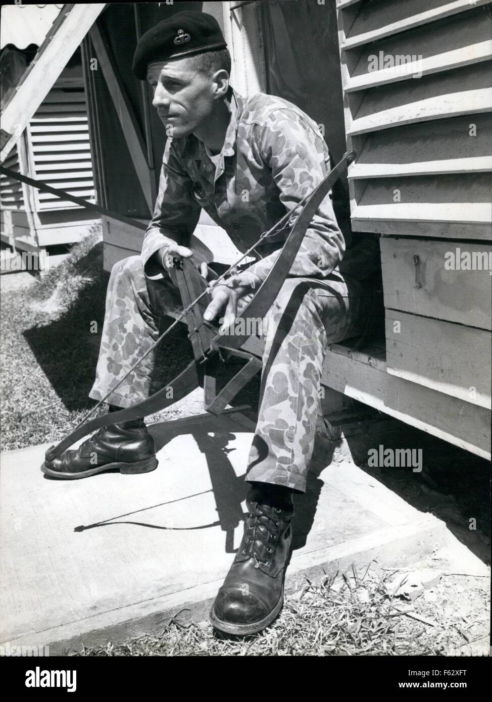 1957 - An American soldier holds across-bow made from the spring of an ...