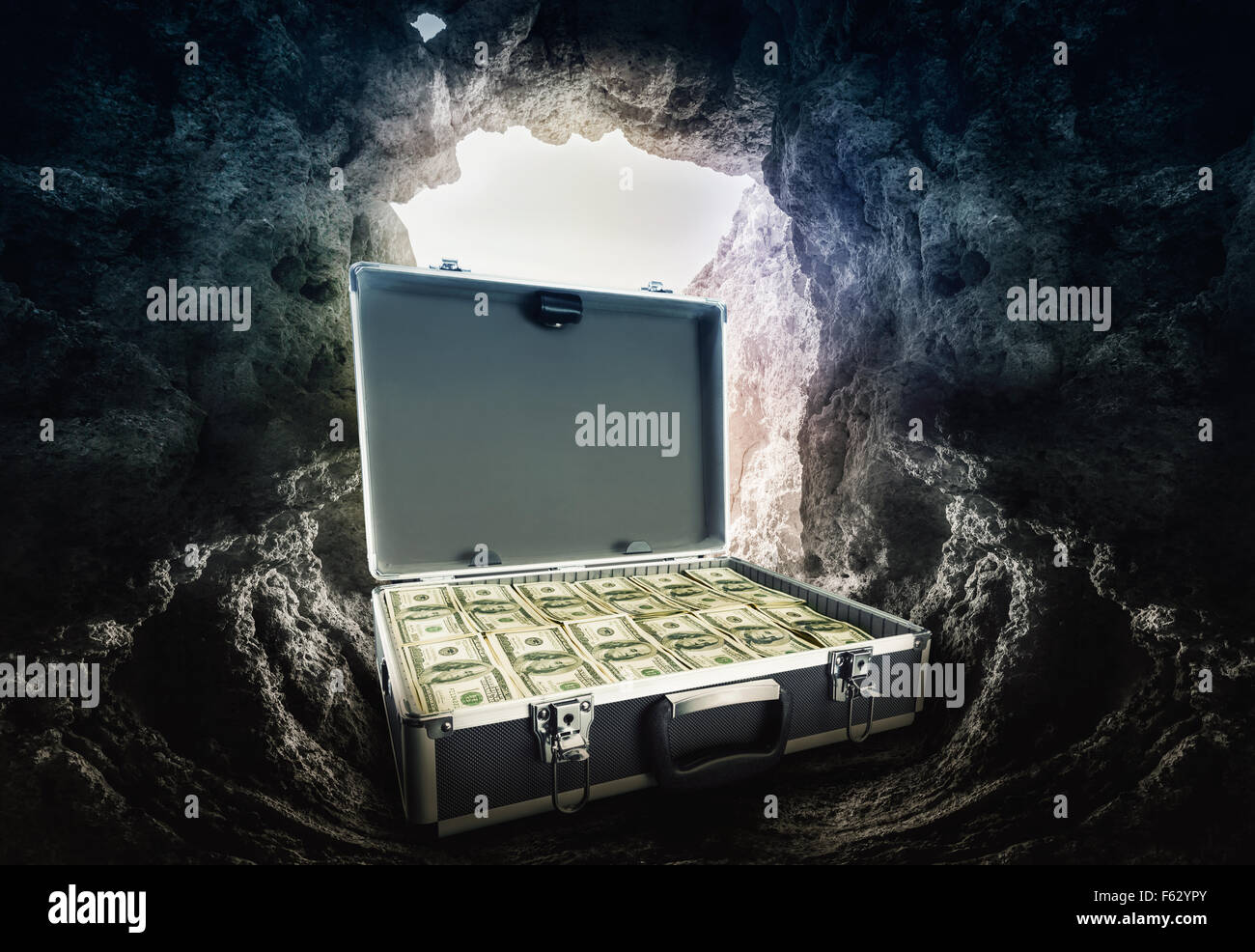Case full of dollars stands inh the cave Stock Photo - Alamy