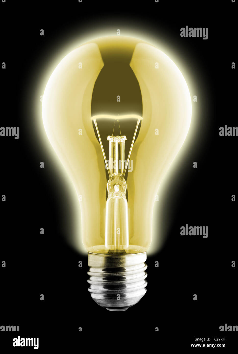 Glowing yellow light bulb on black Stock Photo - Alamy