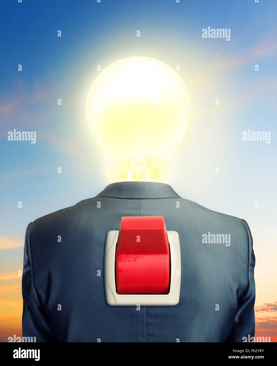 Businessman with electrical outlet on back Stock Photo - Alamy