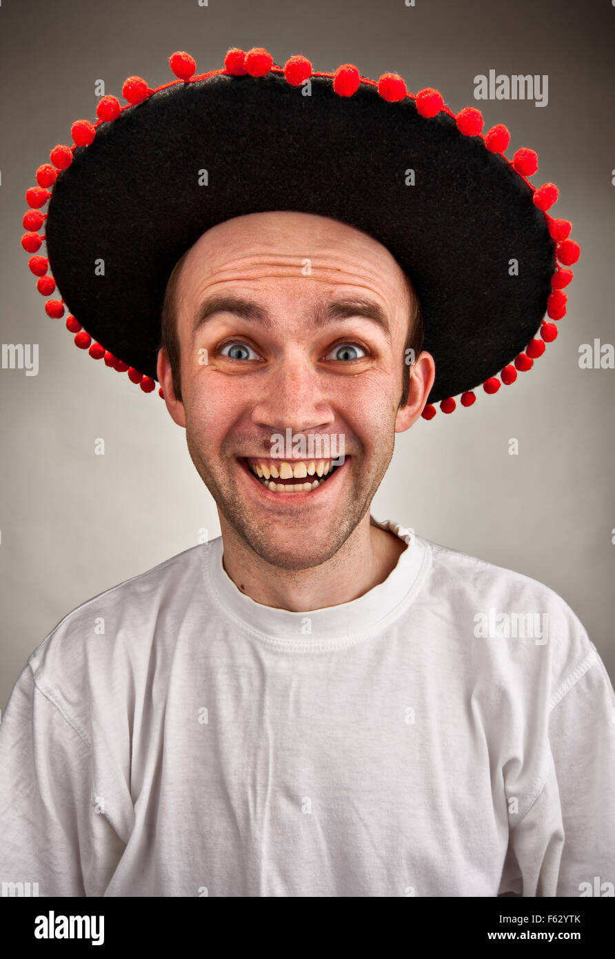 Very happy stupid laughing man in sombrero hat Stock Photo - Alamy