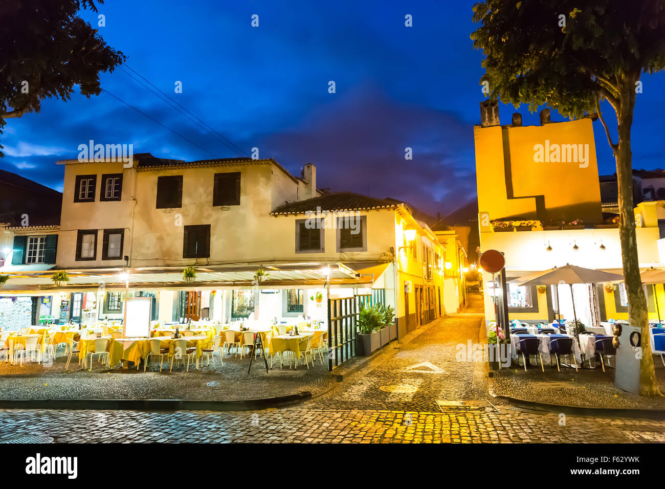 Restaurant outside on european street in the evening Stock Photo - Alamy