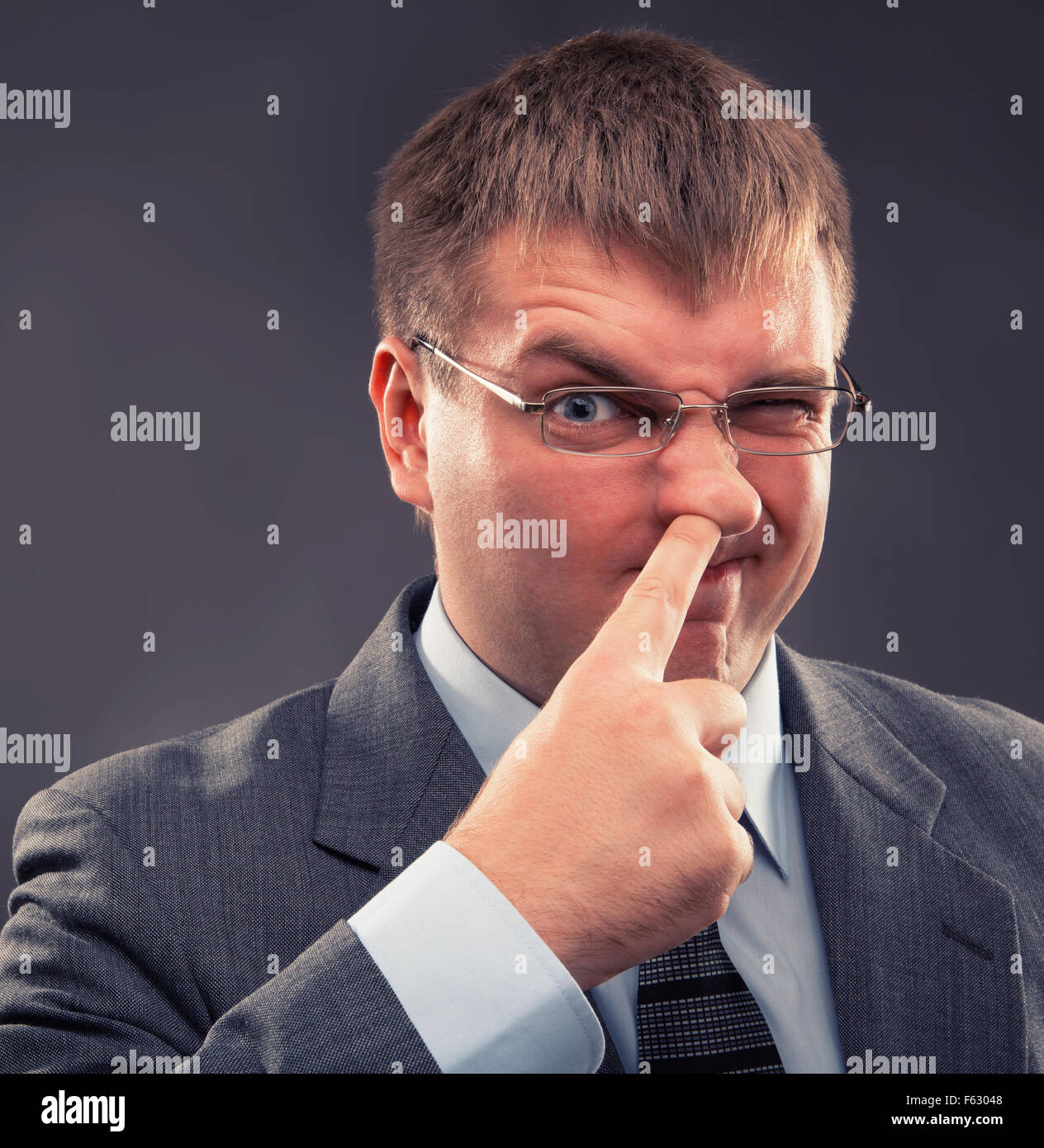 Funny young office worker plays the fool Stock Photo - Alamy