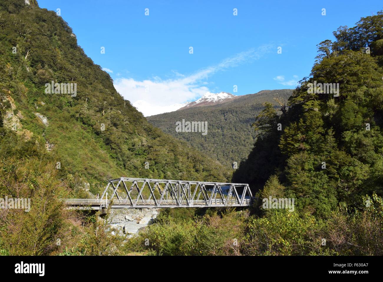 quaint bridge between mountains travelling around New Zealand Stock ...