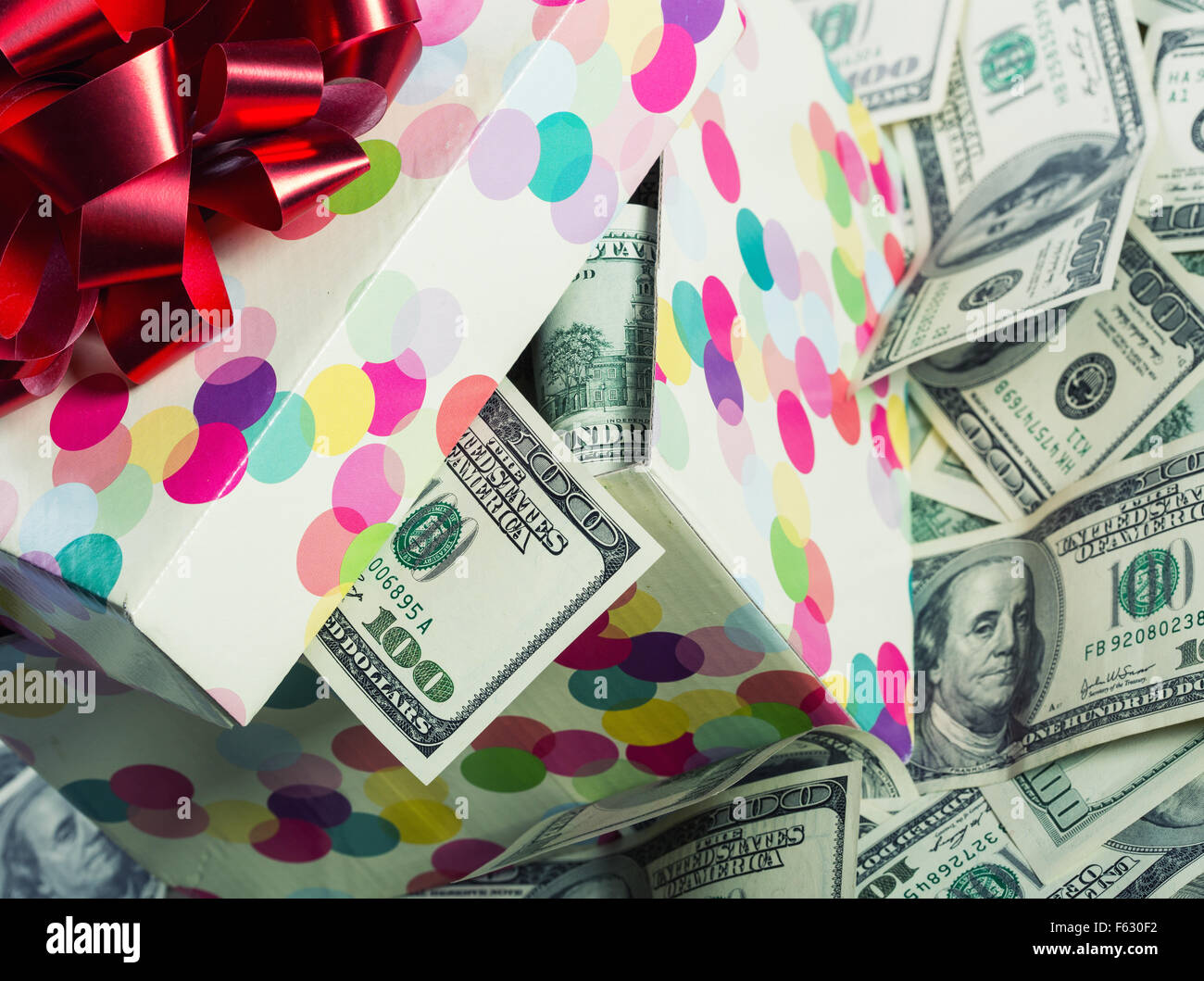 Gift box full of $100 dollar bills Stock Photo - Alamy