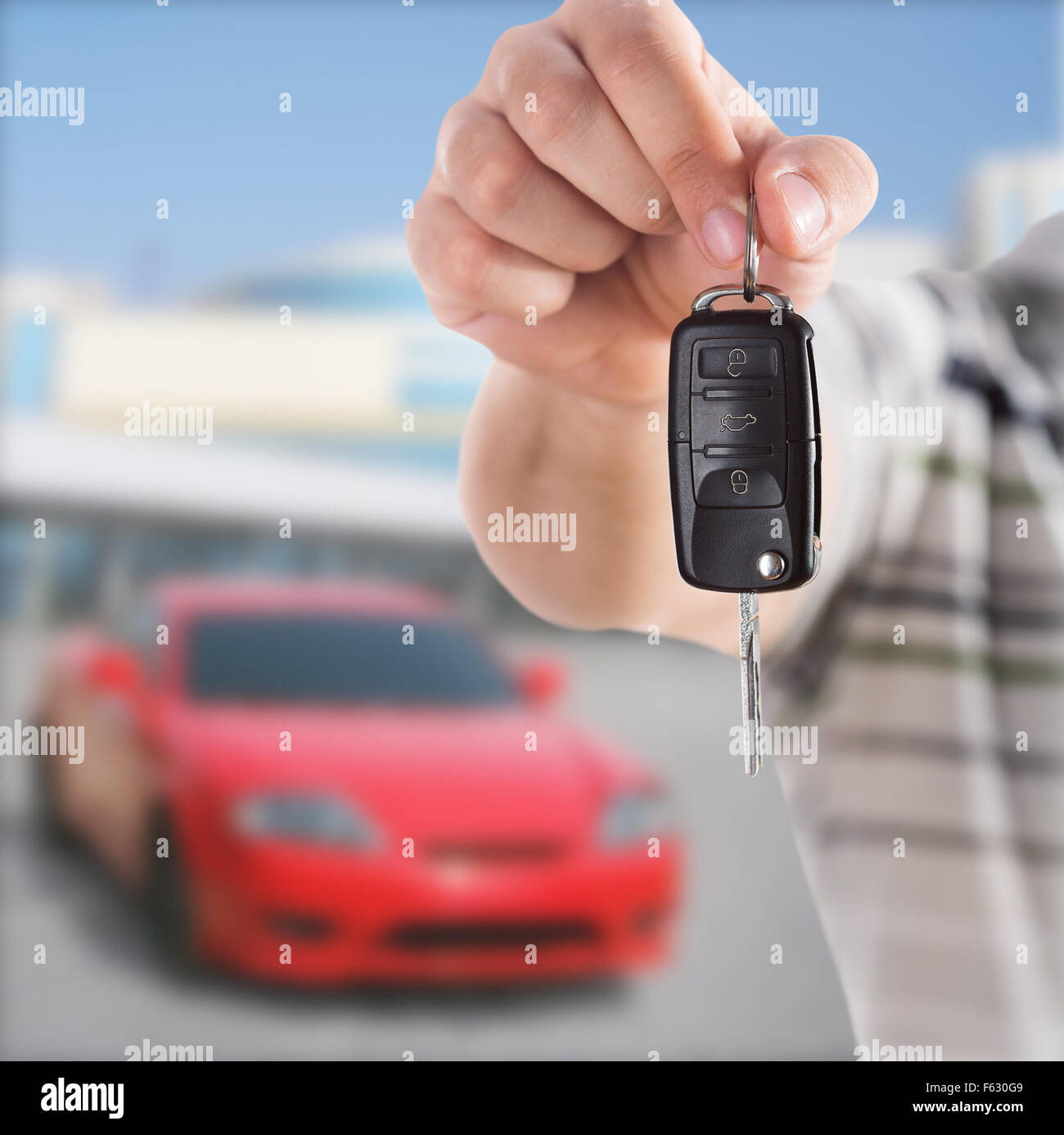 Male hand giving you car key Stock Photo - Alamy