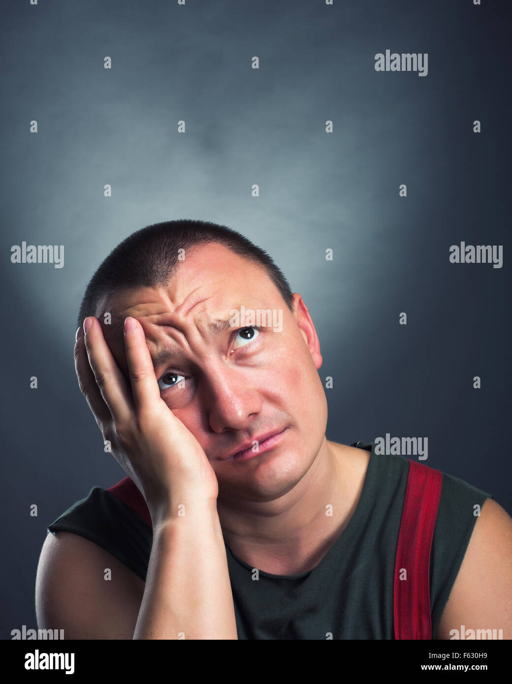 Portrait of sad man looking up Stock Photo - Alamy