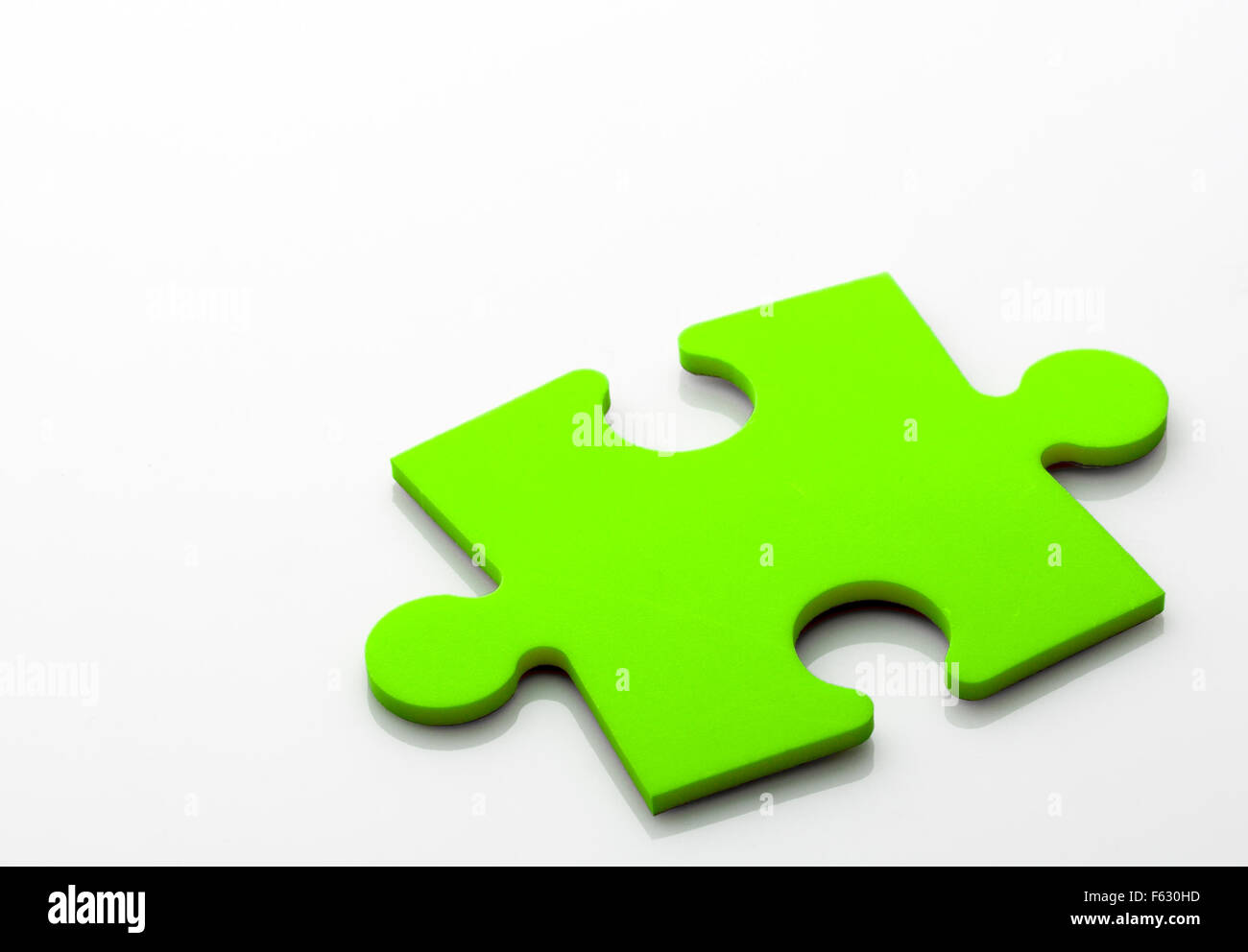 Closeup of jigsaw puzzle piece Stock Photo - Alamy