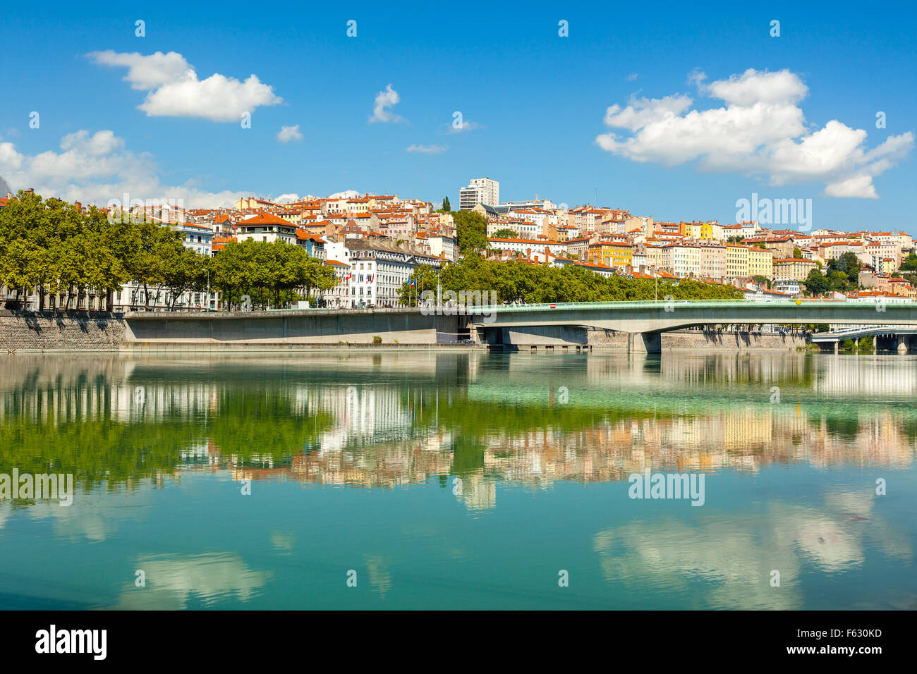 Cityscape of Lyon, France with reflections in the water. Bright sunny ...