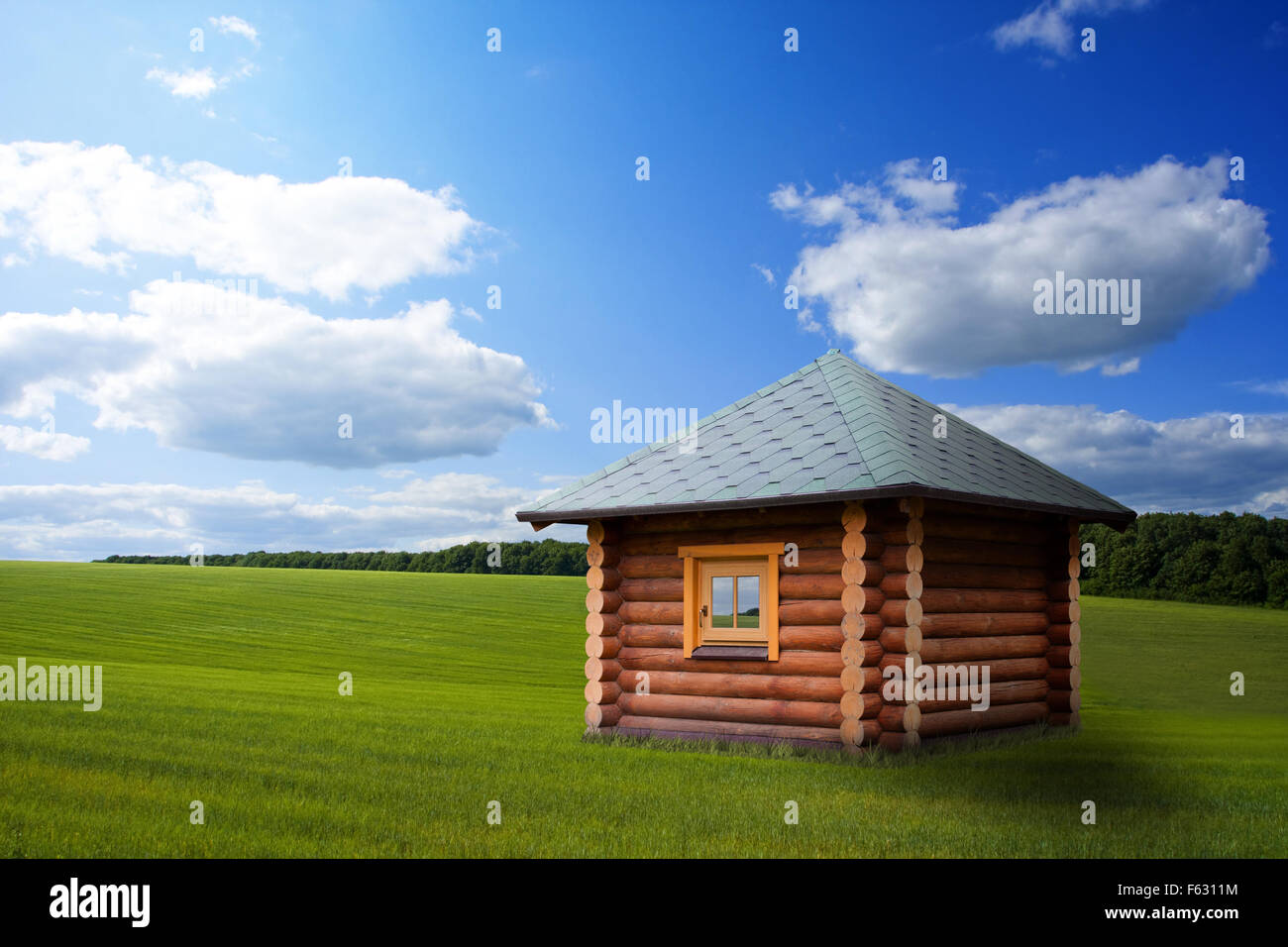 Beautiful day landscape with small house on meadow Stock Photo - Alamy