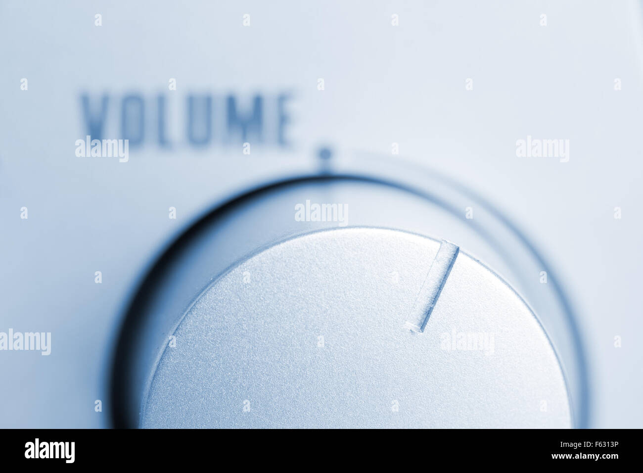 Close-up of loudspeaker volume regulator. Toned in blue Stock Photo - Alamy