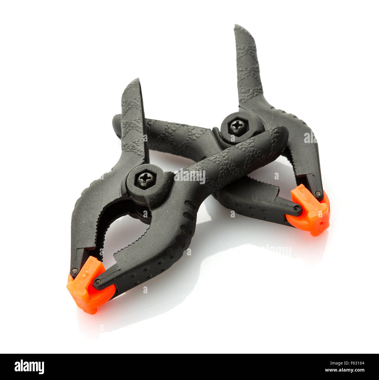 Two plastic clamps isolated on white background Stock Photo - Alamy