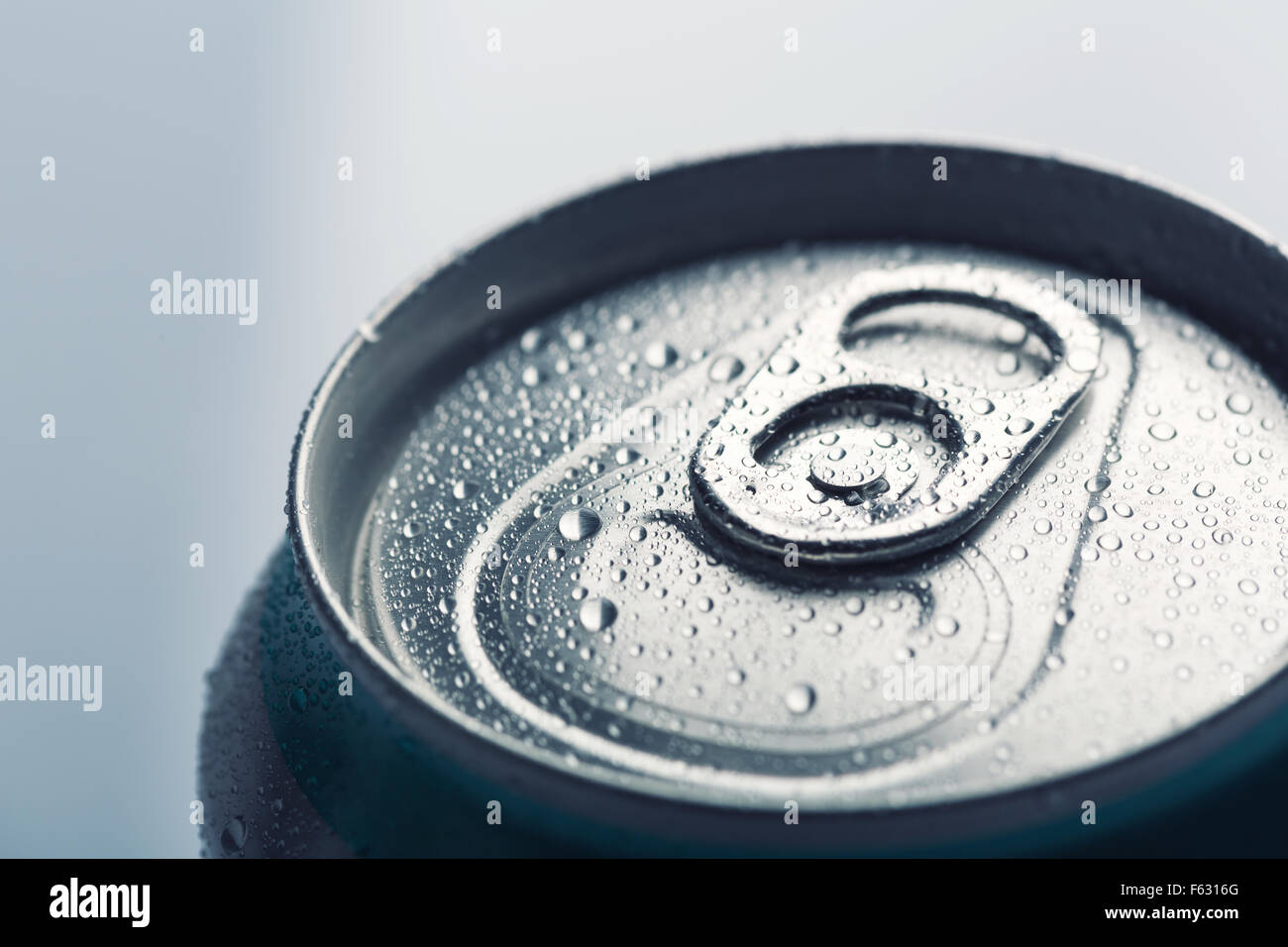 Aluminum can with water drops isolated on gray Stock Photo - Alamy