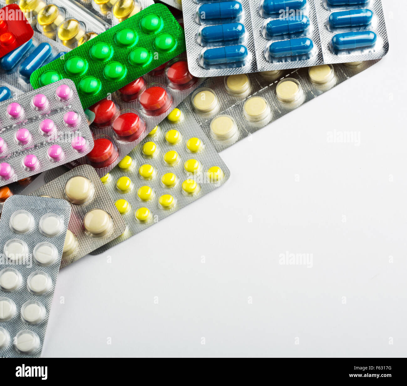 Various colorful pills background with copy space Stock Photo - Alamy