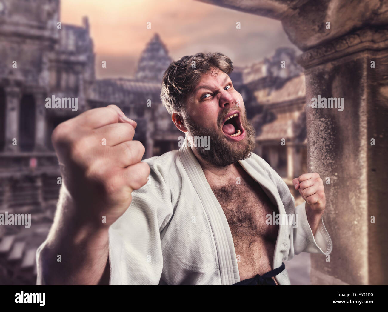 Aggressive bearded karate fighter in white kimono in the temple Stock ...