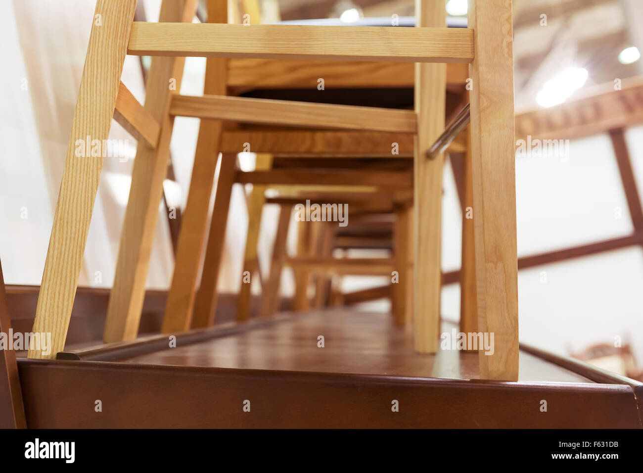 Set of modern wooden chairs in a row Stock Photo - Alamy