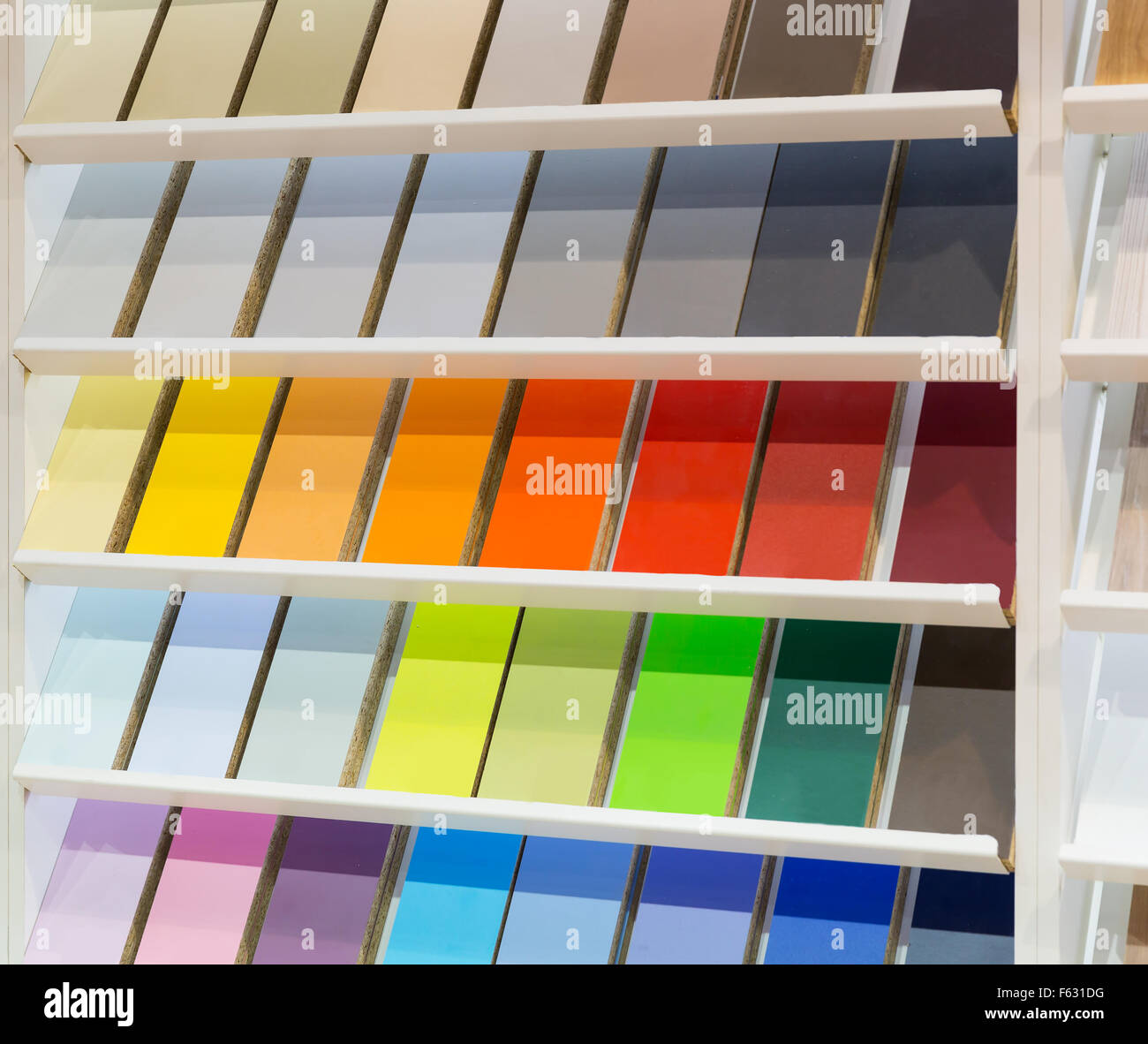 Shelf with many colorful wooden samples Stock Photo - Alamy