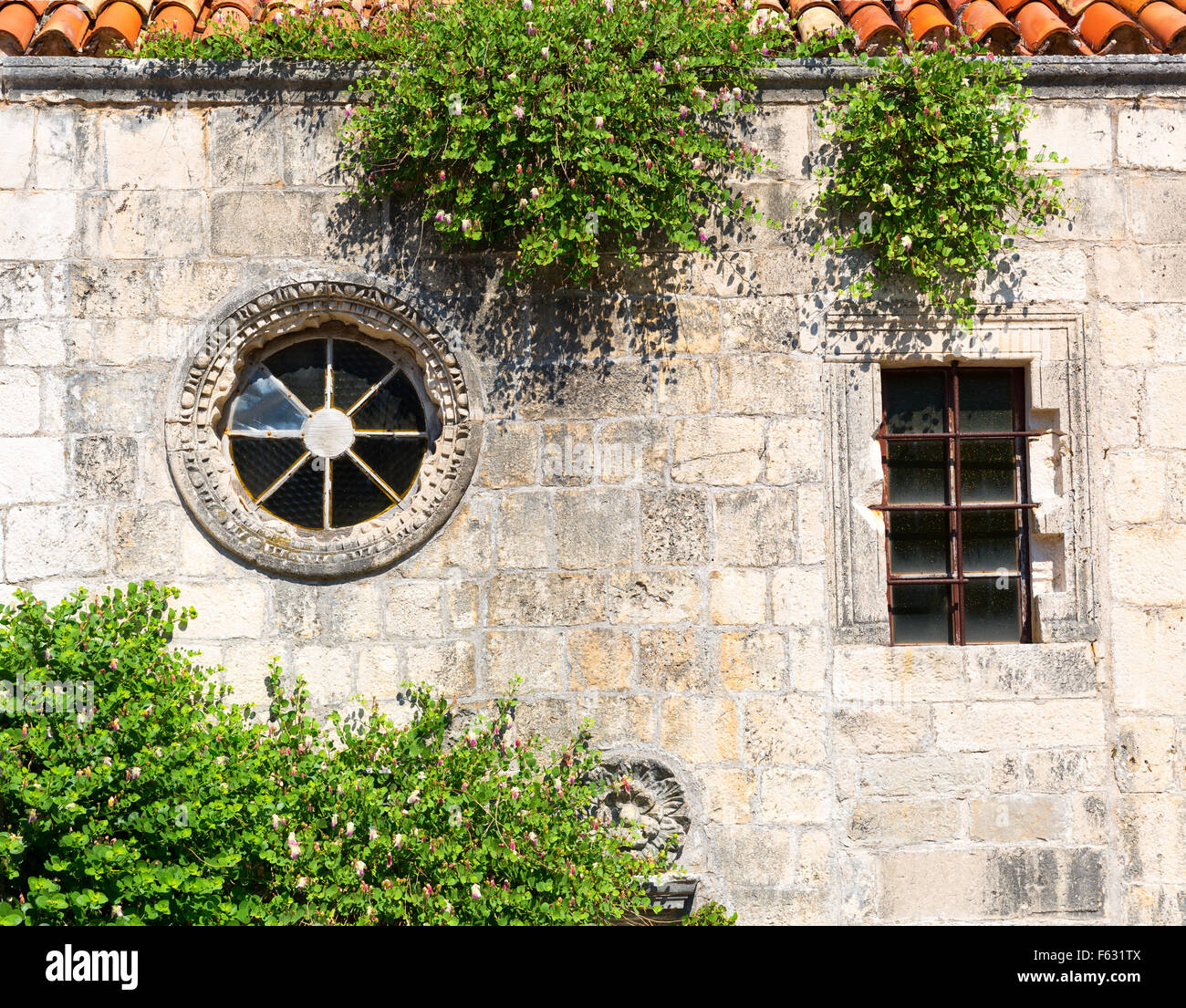 Old stone wall with windows Stock Photo - Alamy