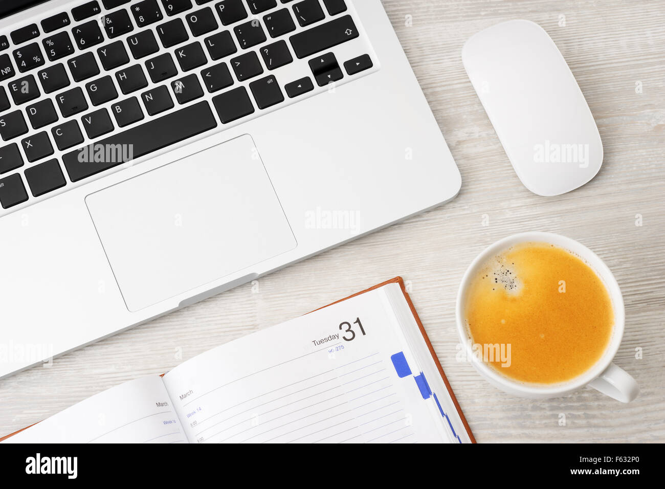 The laptop with the notepad and coffee on the desk in the office Stock ...