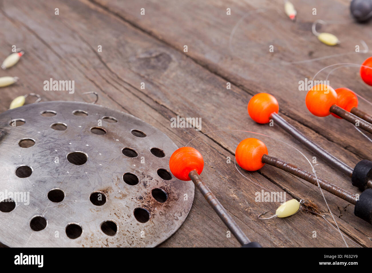 frame from ice fishing rods, tackles and equipment on wooden timber ...