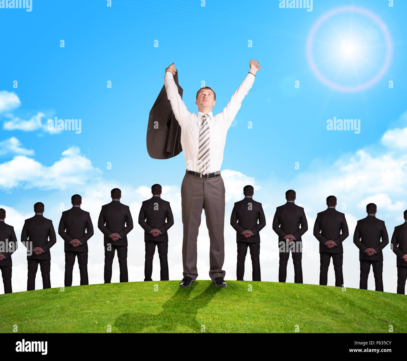 Businessman in winner posture Stock Photo - Alamy