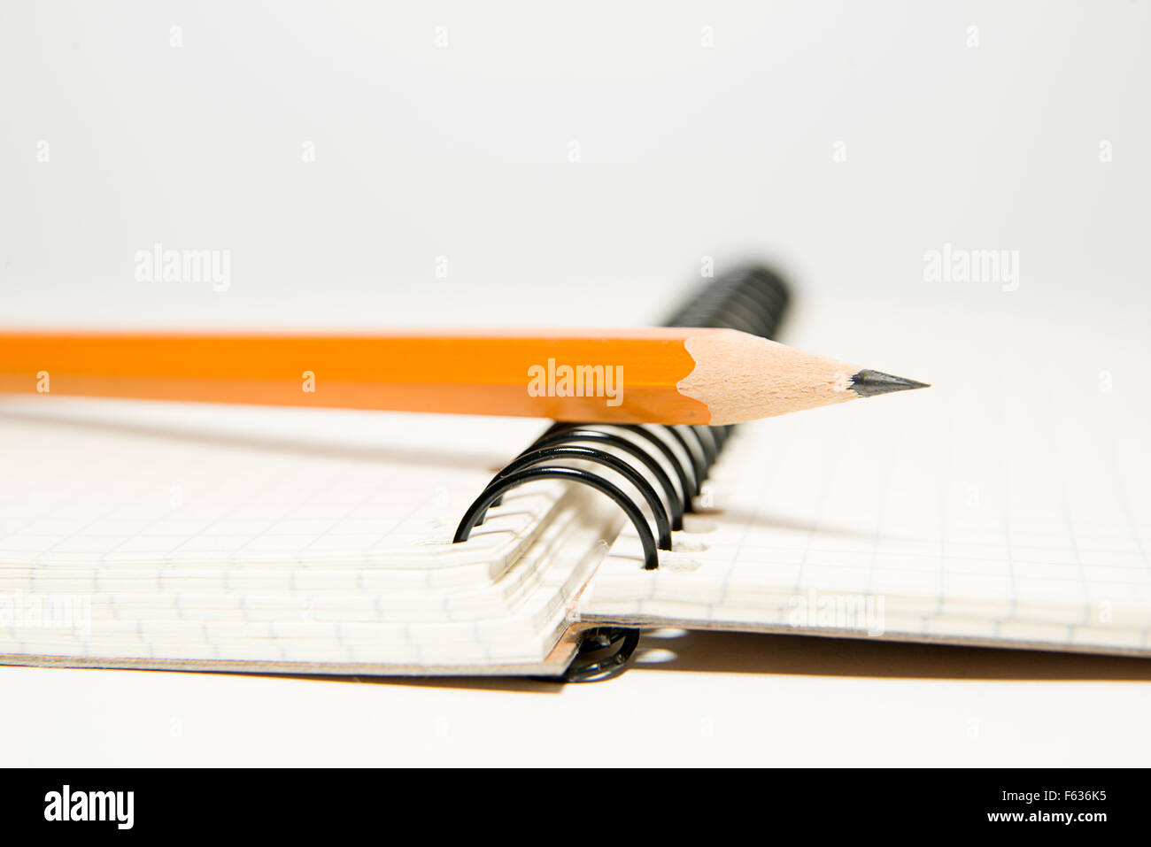 Opened notebook with a blank sheet and pencil on over white Stock Photo ...