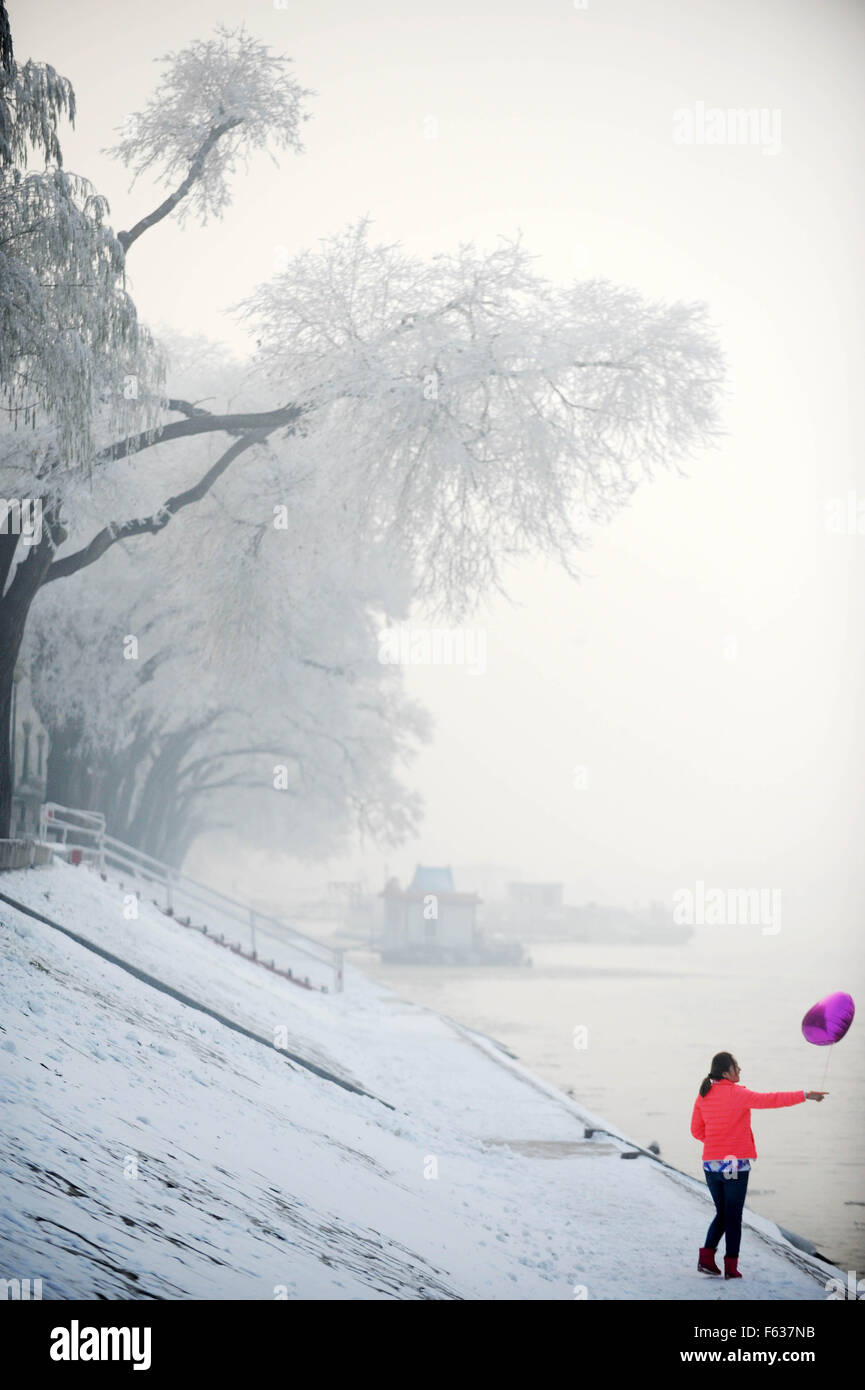 Harbin, China's Heilongjiang Province. 11th Nov, 2015. A woman stands ...