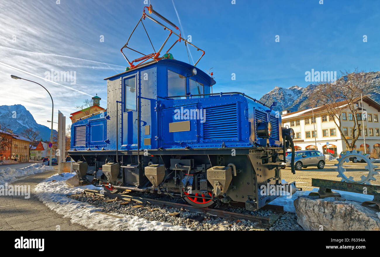 Old vintage steam engine locomotive train in the street of a charming ...