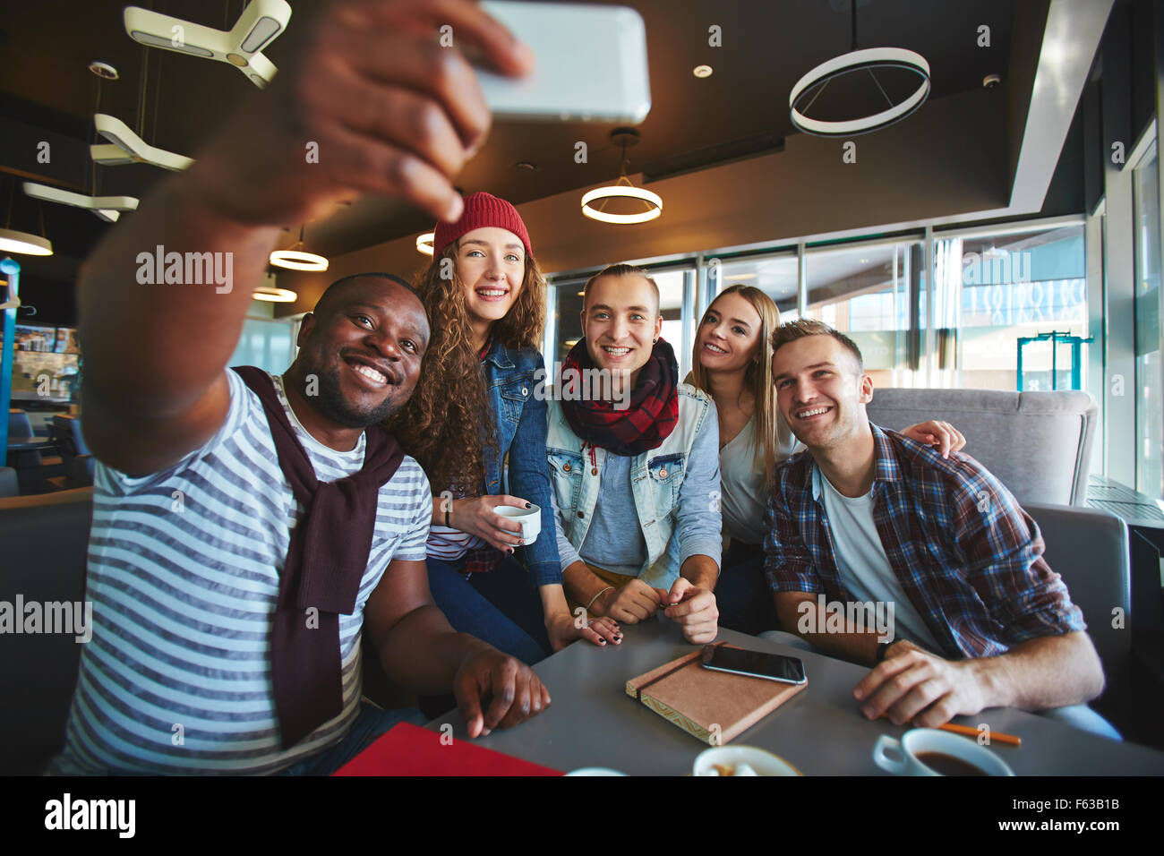 Restful teenagers making selfie while sitting in cafe Stock Photo - Alamy