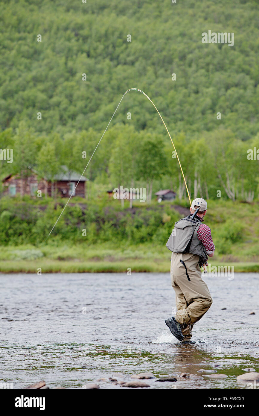 Salmon fly fishing at Teno (Tana) River, on the border of Finland and ...